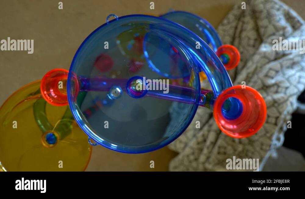 Marbles dropping down a hole going into different sections of a marble ...