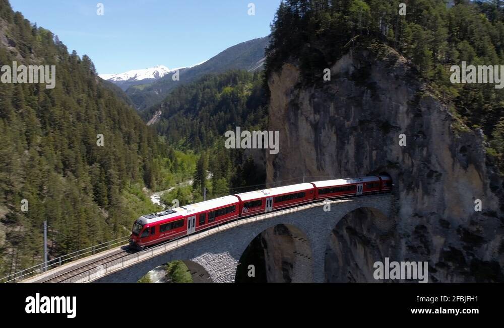 Red train of Bernina Glaciers on Landwasser viaduct. Unesco World ...