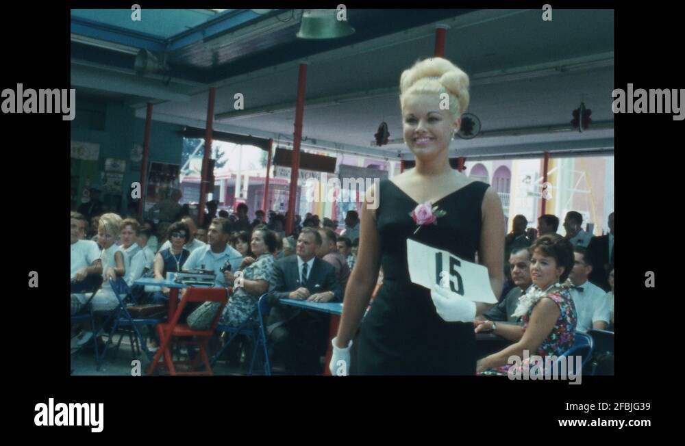 1960s: Beauty pageant contestants carry numbers across dance floor and ...