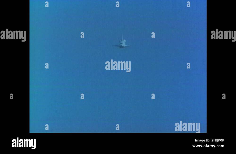 1980s: UNITED STATES: space shuttle comes in to Earth's atmosphere ...