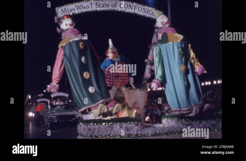 1960s: Clowns on parade float. Miss New Hampshire waves at crowd. Miss ...