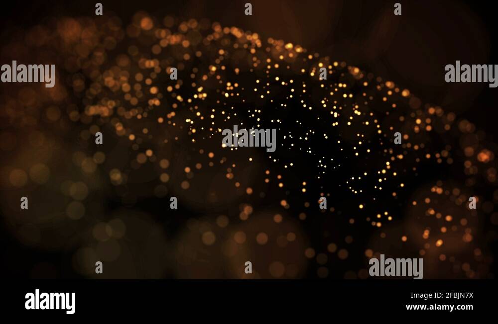 gold particles in liquid float and glisten. Background with glittering ...