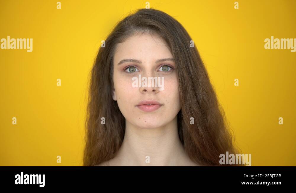 shock, fear, horro. Portrait of young shocked afraid woman teen girl on yellow Stock Video ...