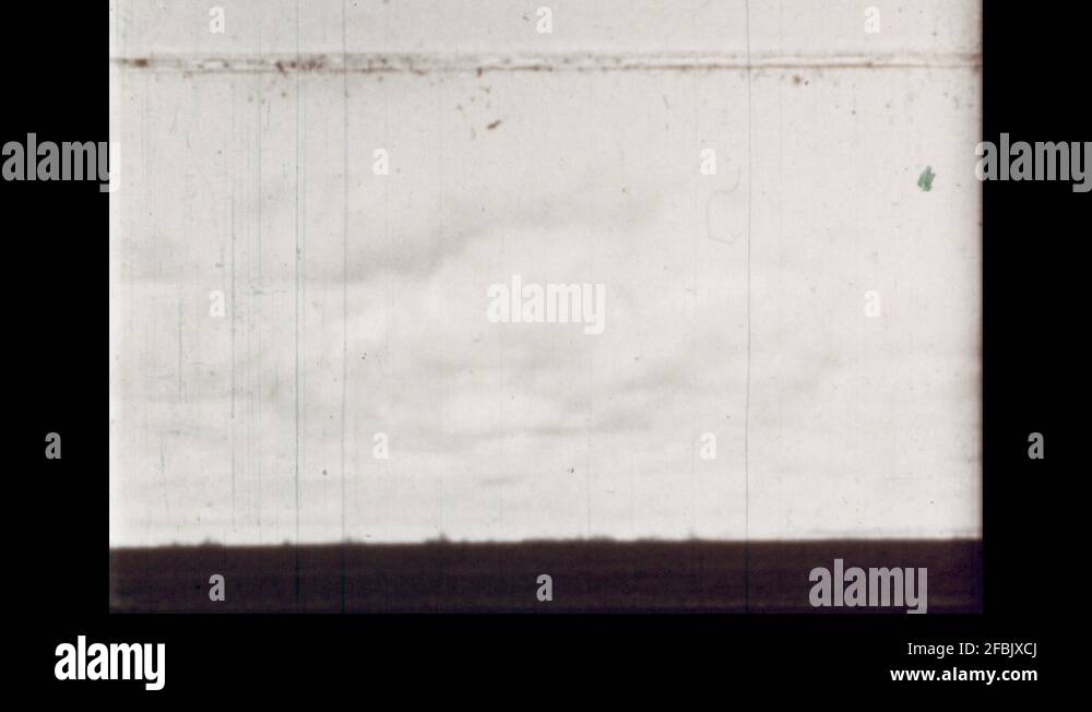 1940s: UNITED STATES: nuclear explosion on island. Explosion on horizon ...