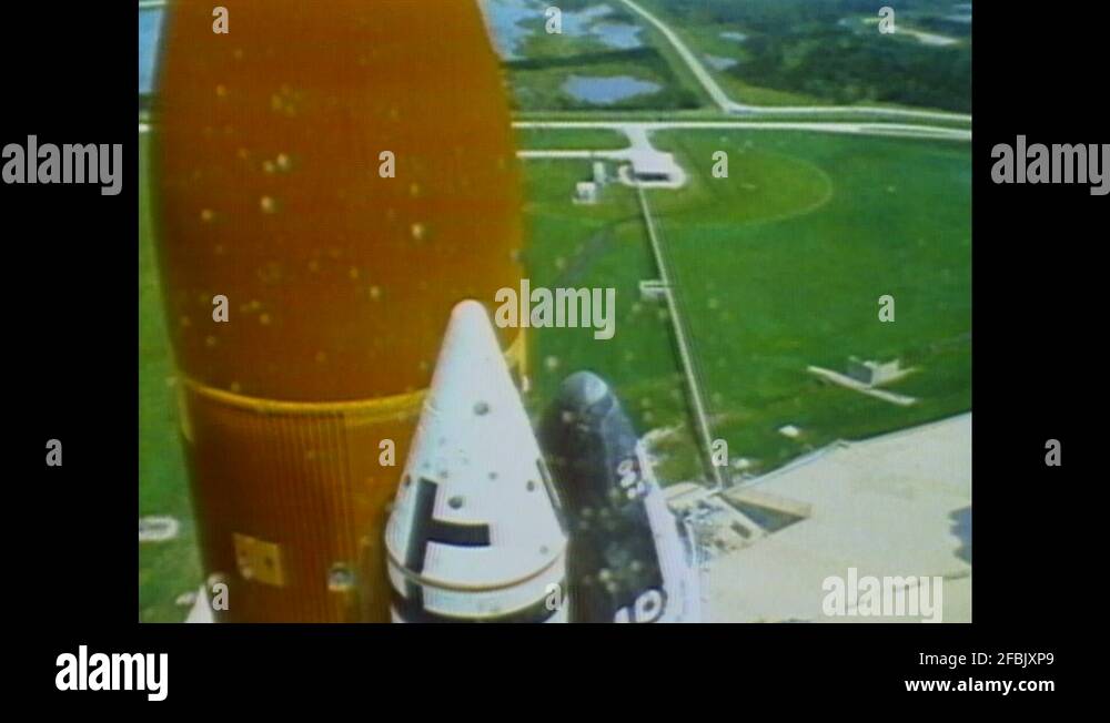 1980s: space shuttle launching, looking out of a small window on the ...