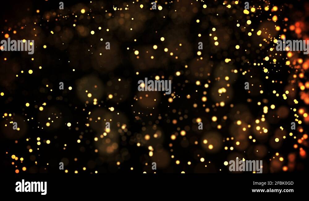gold particles in liquid float and glisten. Background with glittering ...