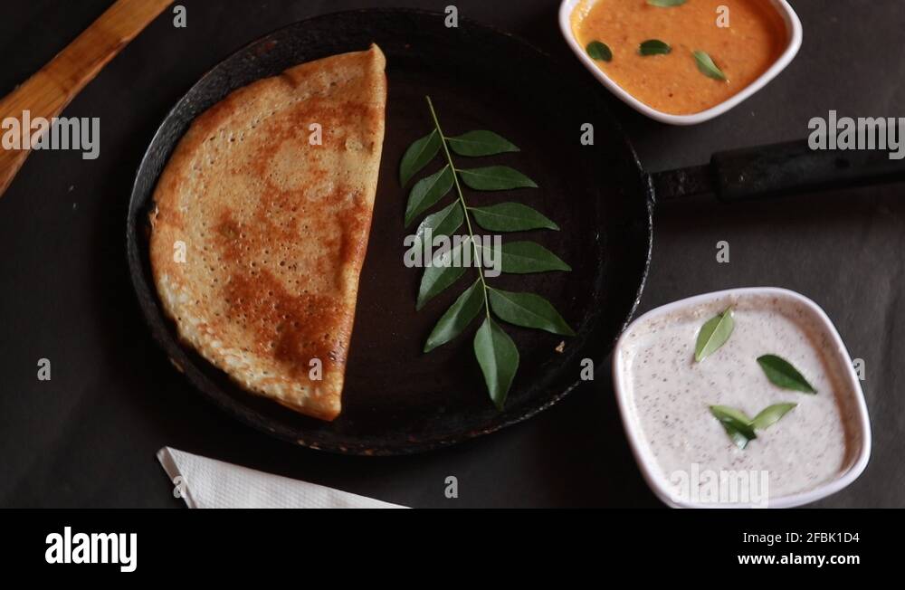 rotating Masala dosa is a South Indian meal served with sambhar and ...