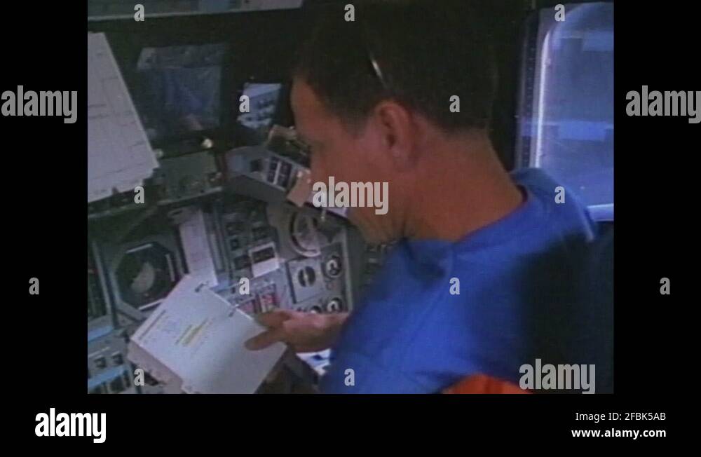 1980s: UNITED STATES: astronaut goes through check list. Astronaut ...