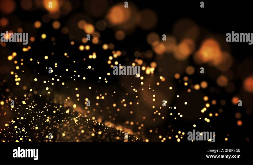 gold particles in liquid float and glisten. Background with glittering ...