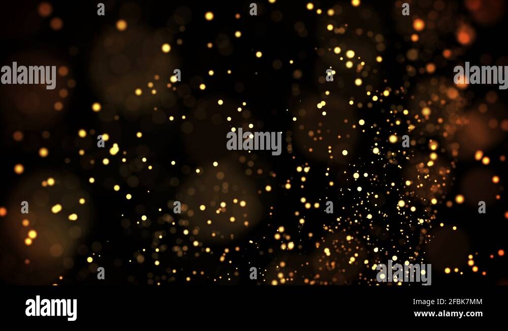 gold particles in liquid float and glisten. Background with glittering ...