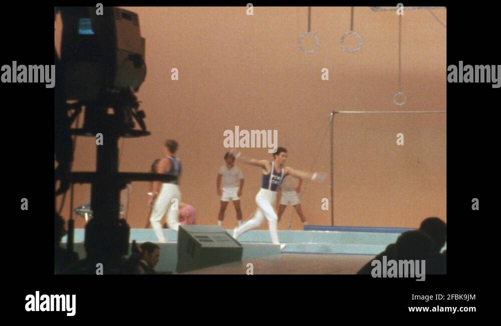 1970s: Men and women sing and perform gymnastics and exercise on stage ...