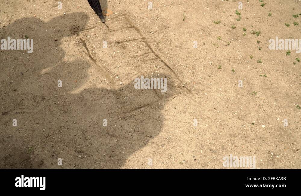 Drawing images in the sand. Drawing on sand illustrates a relaxing ...