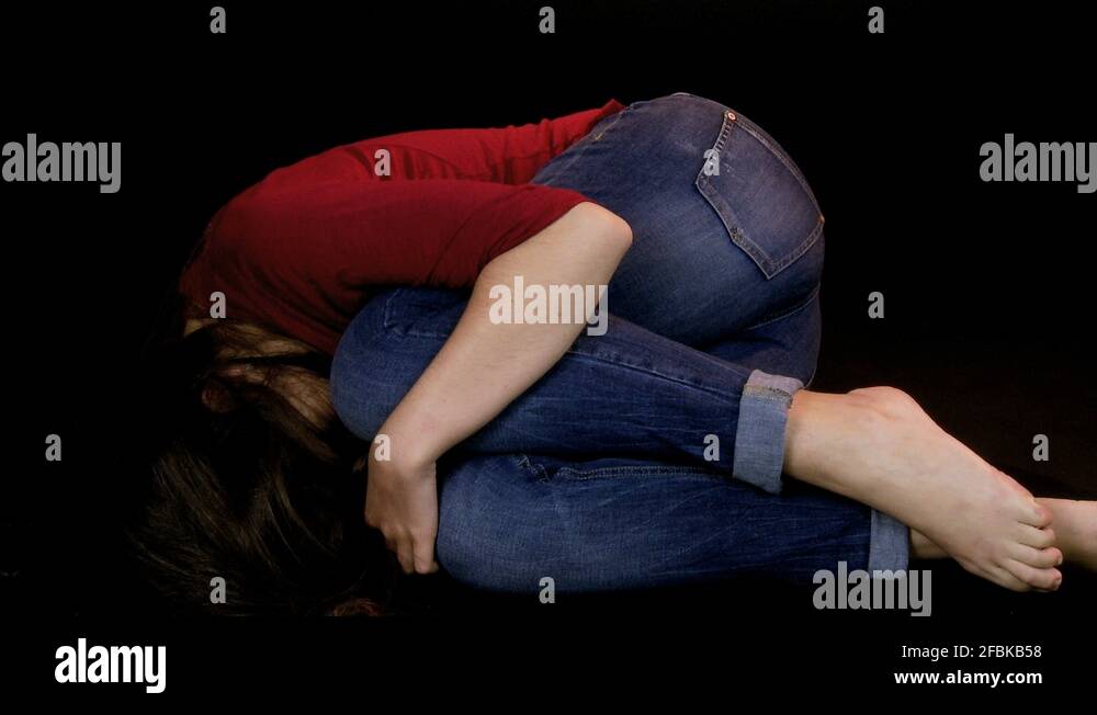 sad girl crying laying down Stock Video Footage - Alamy