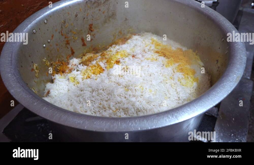 First look of freshly made Chicken Biryani Deg with steams in slow ...