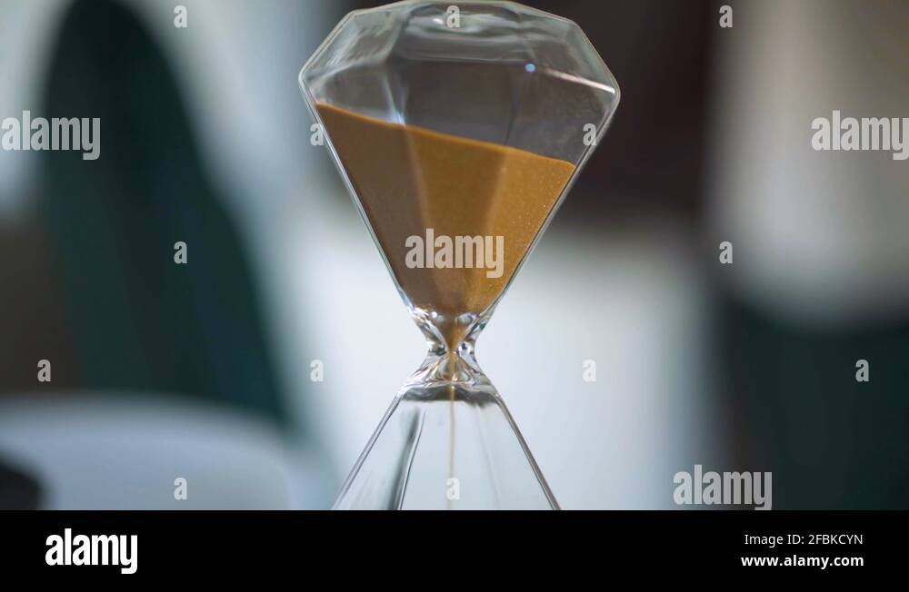 Tilt down from the top to the bottom of an hourglass Stock Video ...