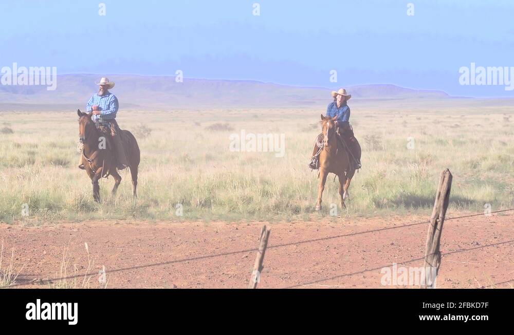 Classic Wild West scene of people riding horseback through Texas Stock ...