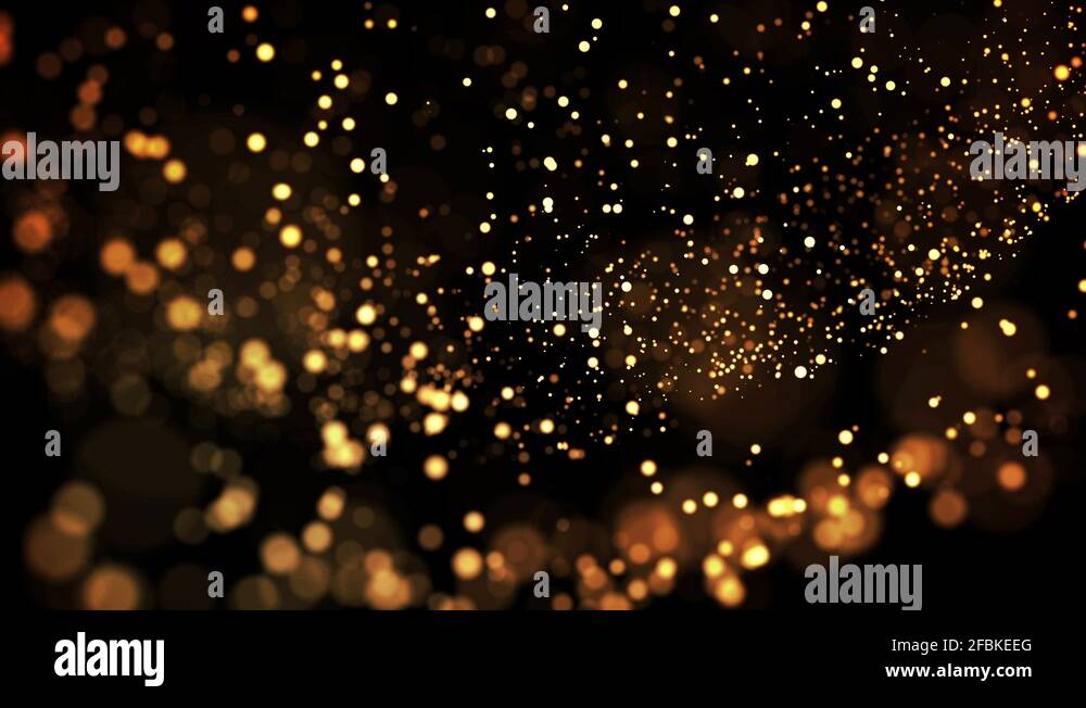 gold particles in liquid float and glisten. Background with glittering ...
