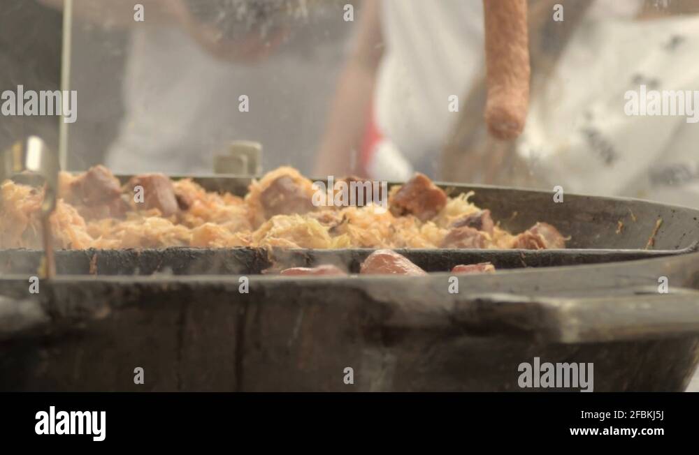 Piping hot food cooking at street market Stock Video Footage - Alamy