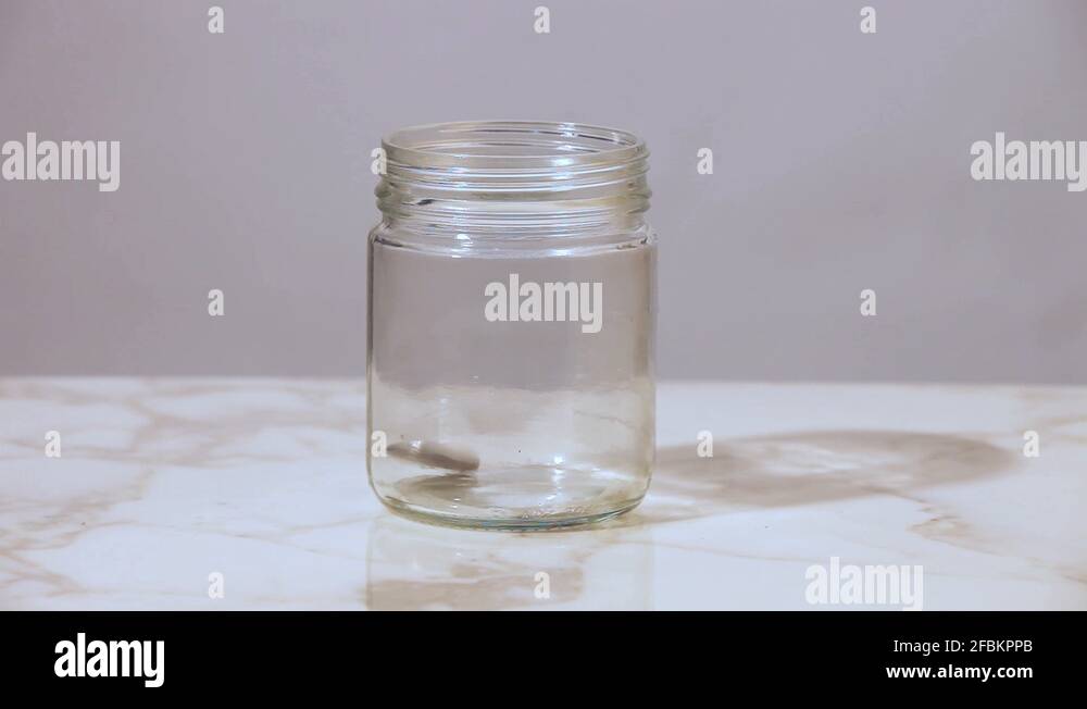 Coins filling glass jar Stock Videos & Footage - HD and 4K Video Clips ...