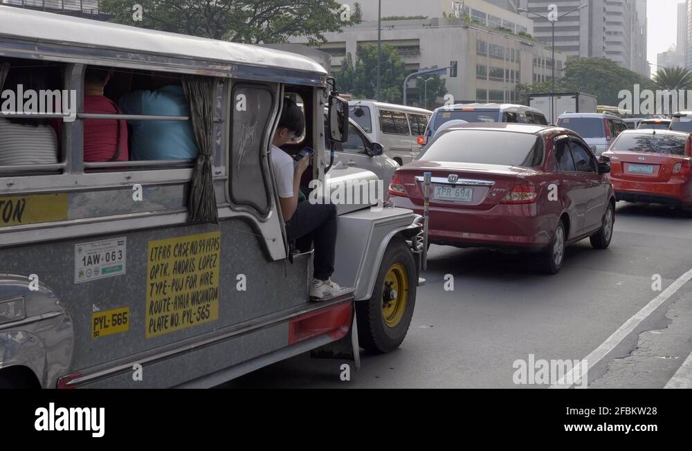 Traditional transport taxi carrying people through busy metro extra ...