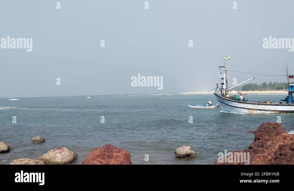 Fishing boats heading deep into Arabian sea at Betul Fort Goa, India ...