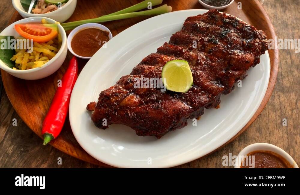 Indonesian food, spiced slow cooked ribs traditional food in Bali. BBQ ...