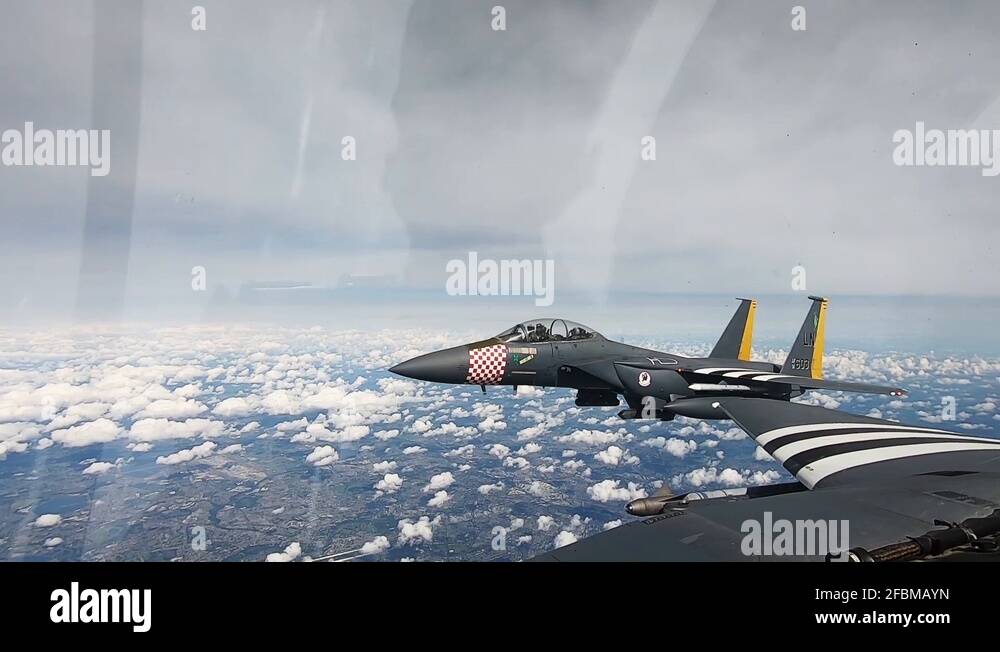 F-15 Strike Eagles painted in WWII colors fly in formation for D-Day ...