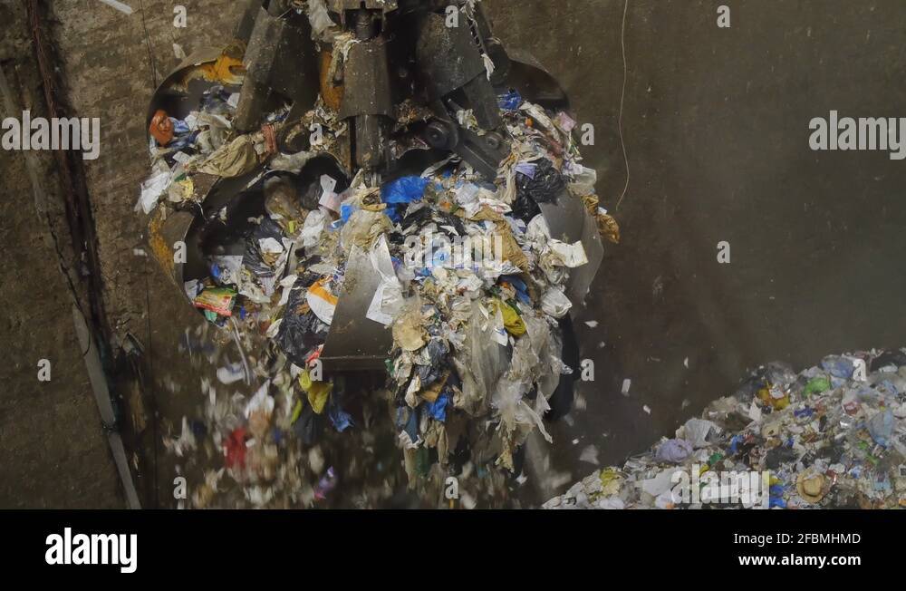 Crane depositing Garbage in an Industrial Dumpster. Waste Recycling ...