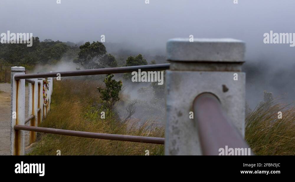 volcanic steam blowing the wind in volcano national park, handrail ...