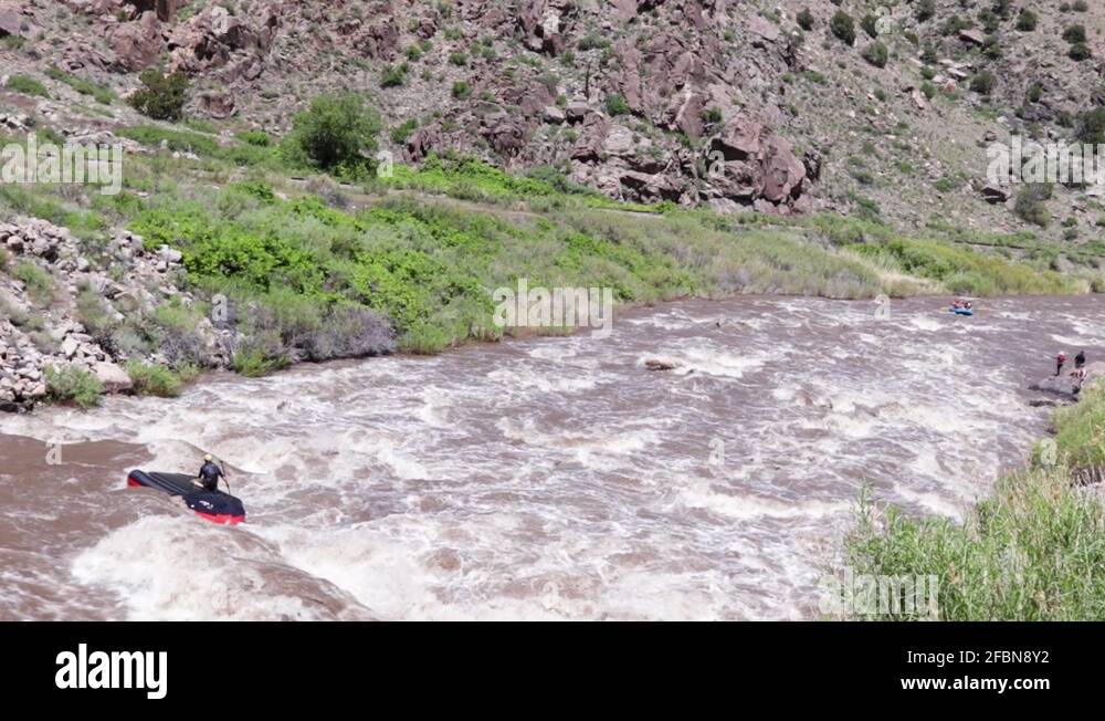 Raft guide ends up riding upside down raft after it flips with rafters ...