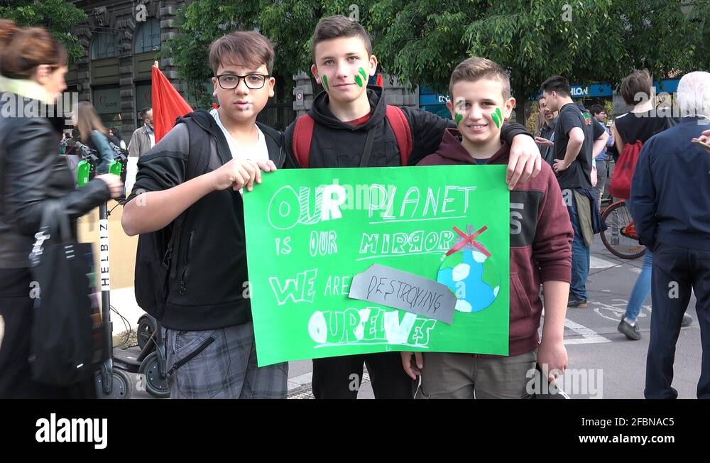 Boys picketing with picket sign, Friday for future, global strike Milan ...