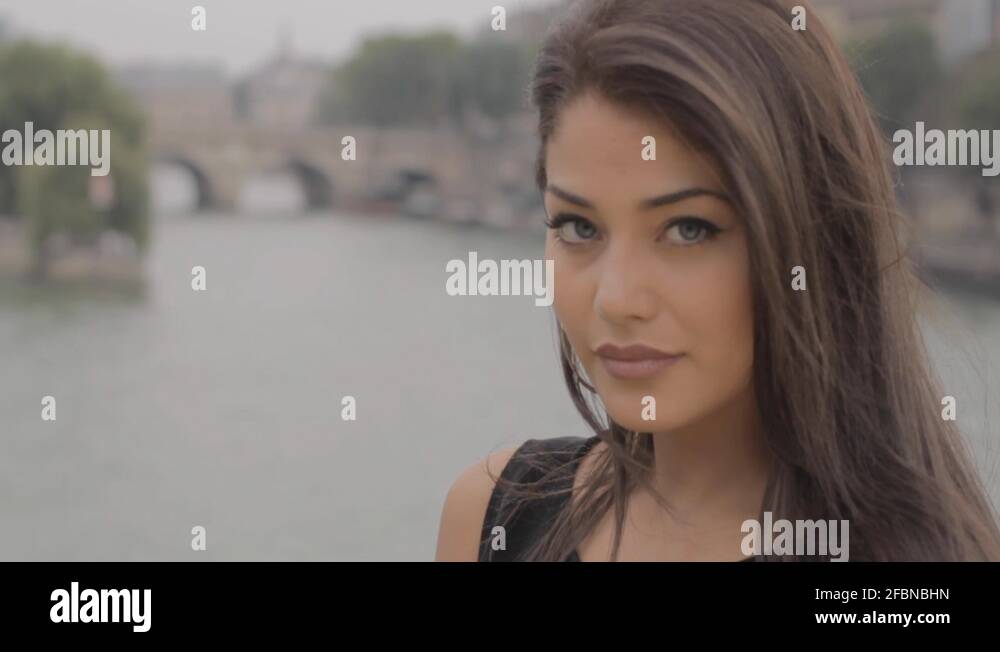 Attractive sad model woman with blue eyes and brown hair posing on a ...