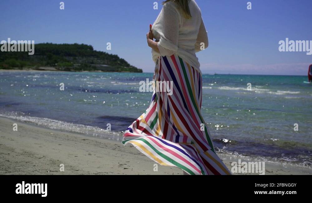 Beautiful Blonde Woman Taking Off Her Light Shirt To Feel Fresh Ocean Air On Stock Video Footage