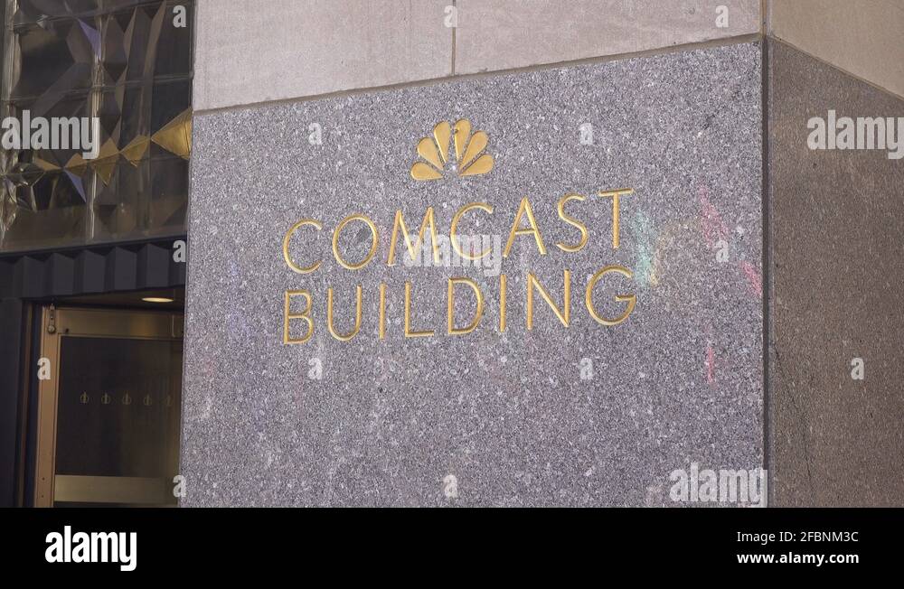 Comcast building entrance exterior sign NYC 4k Stock Video Footage - Alamy