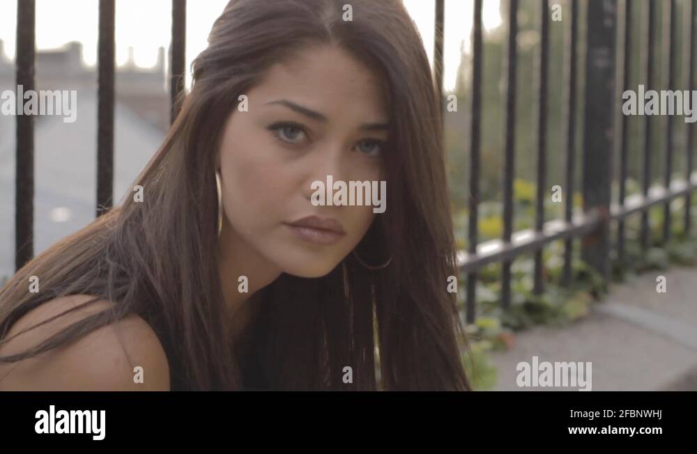 Beautiful blue-eyed sad woman girl model with brown hair posing at ...