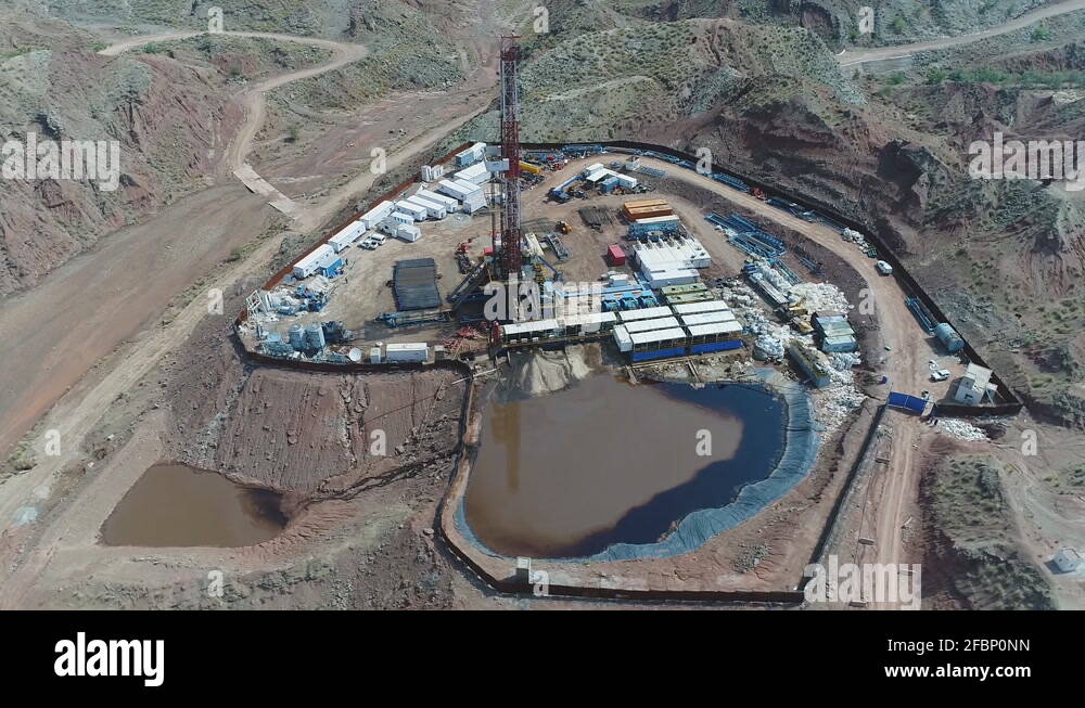 Crude oil drilling well pumping the black gold out of the soil Stock ...
