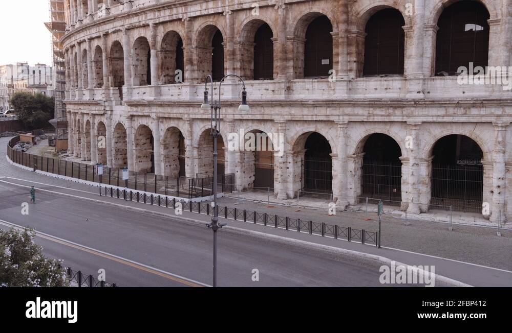 In a semi-abandoned Rome a survivor walks near Coliseum "Colosseo Stock ...