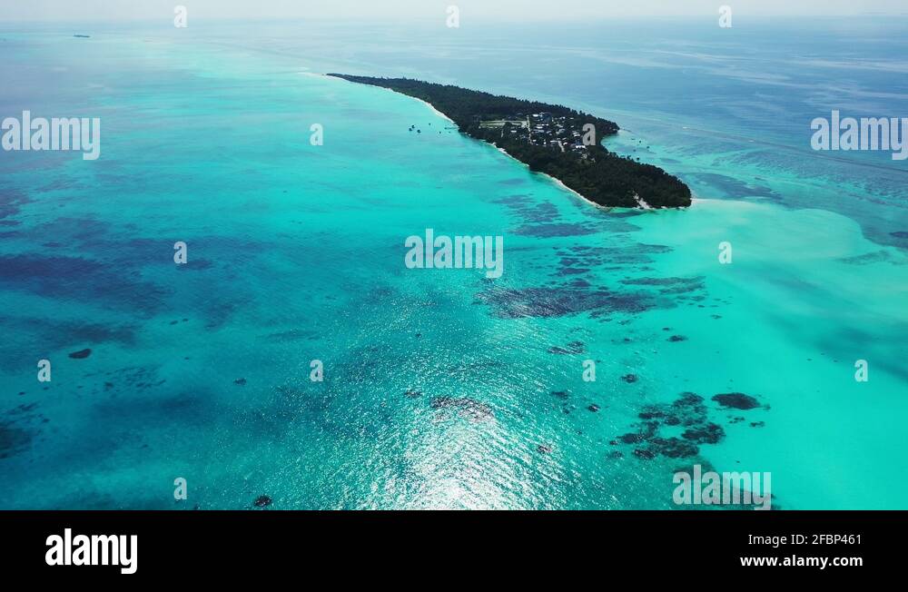 Tropical island with a village and forest in it viewn from above Stock ...