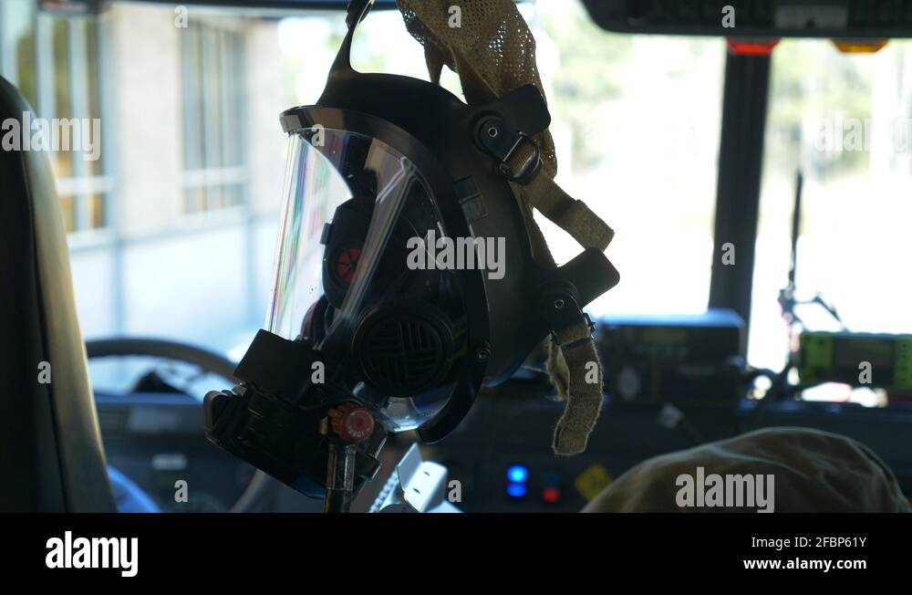 Firefighter respirator mask hanging inside a fire truck ready for use ...