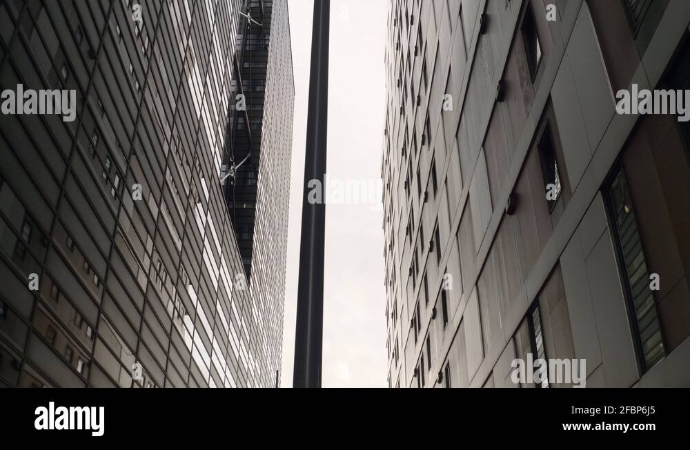 4K gimbal video with smooth forward tilt motion of light pole in the ...