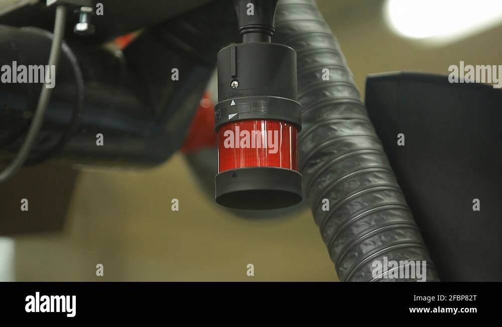 Red light lighting up in industrial factory. Isolated warning, warn ...