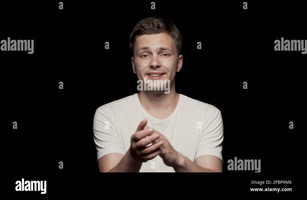 Attractive man clapping close up shot. Black background Stock Video ...
