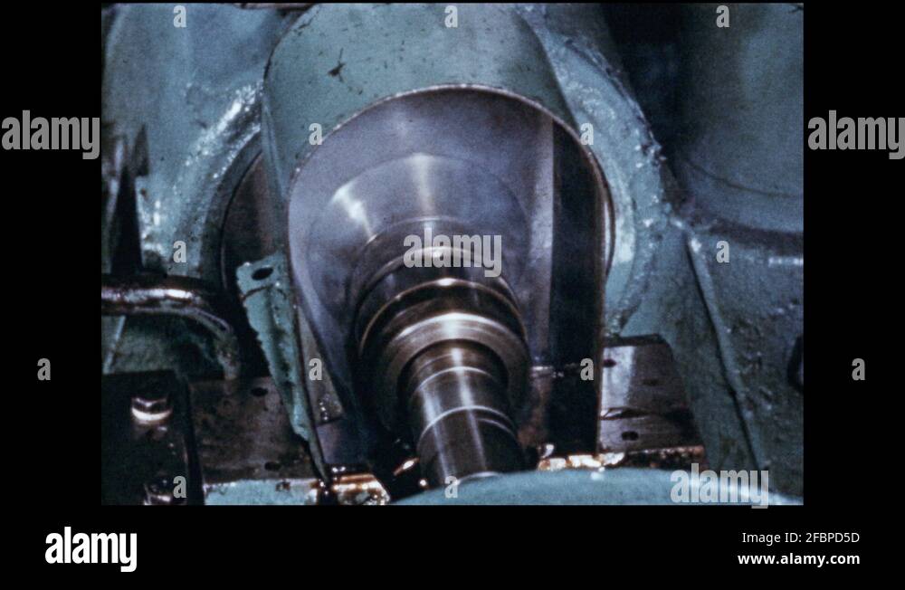 1950s: UNITED STATES: operator stops machine. Numbers on scale. Test ...