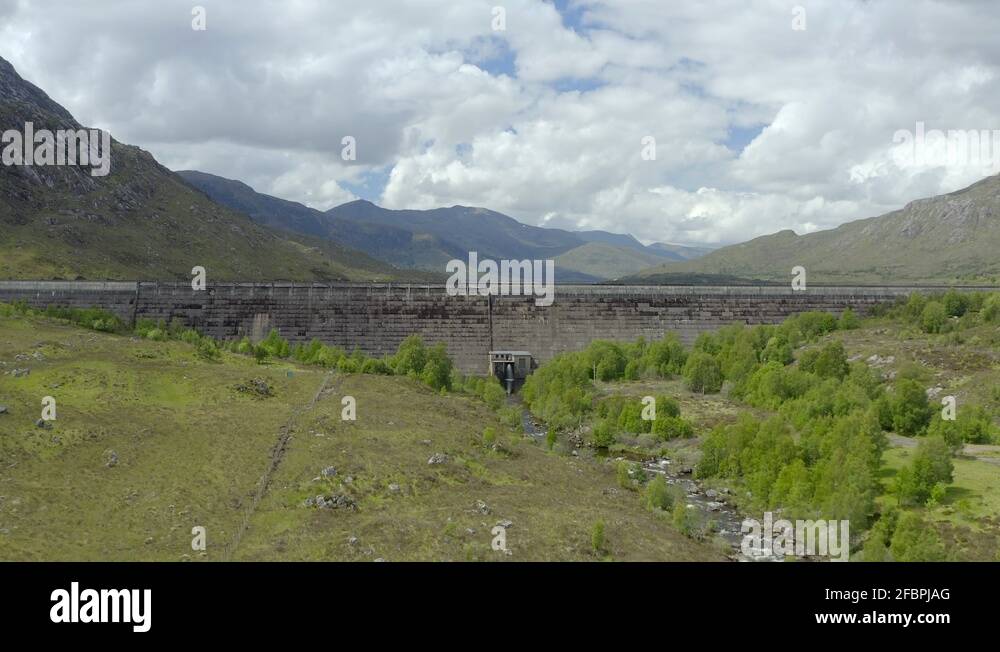 An aerial view of Cluanie Dam on Loch Cluanie on a nice day. Rising and ...