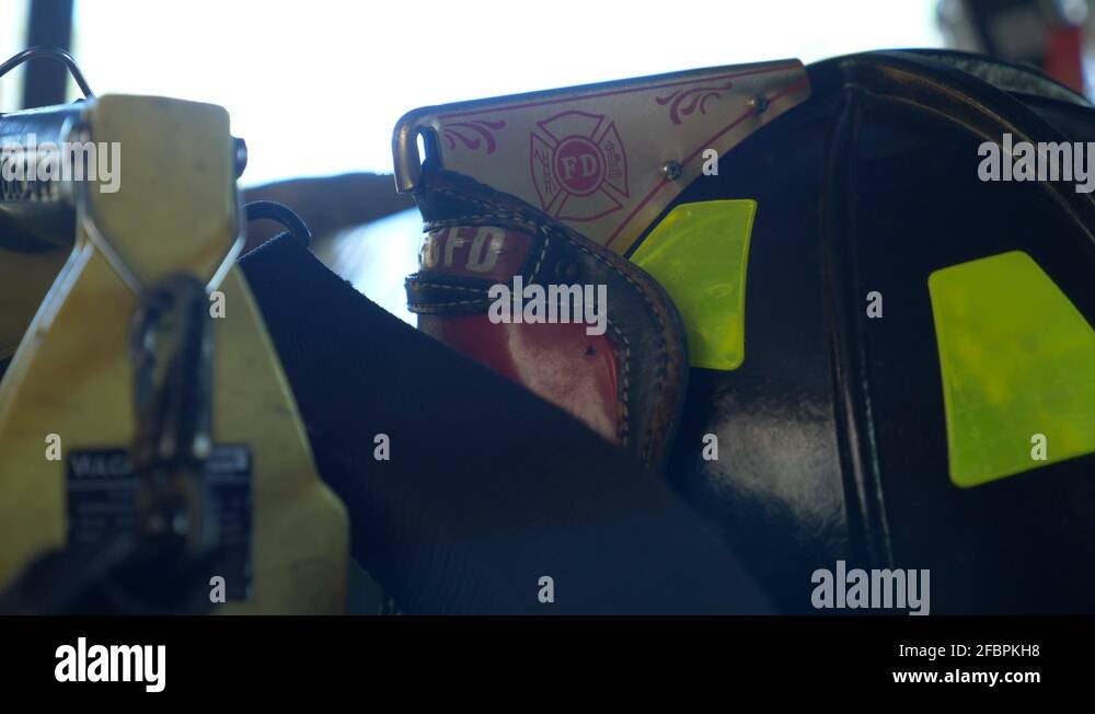 Black firefighter helmet on top of firefighting gear inside a fire ...