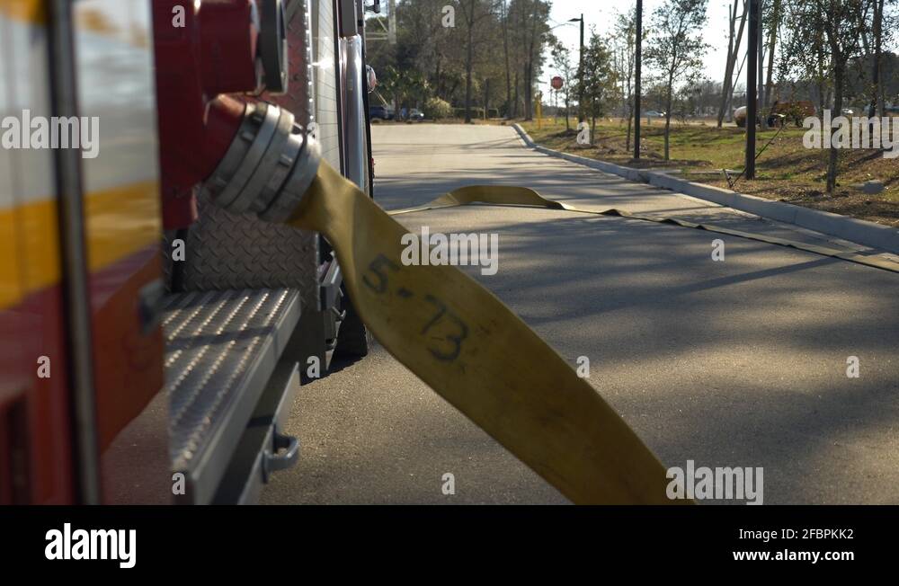 Fire hose fills with water at the scene of an emergency Stock Video ...