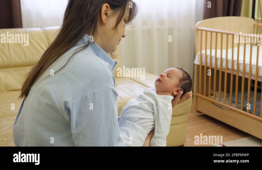 Newborn baby child lay and sleep on mother arms, fragile life Stock ...