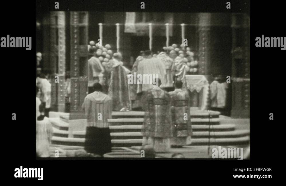 1950s: UNITED STATES: Archbishop blesses sacrament during mass. Holy ...