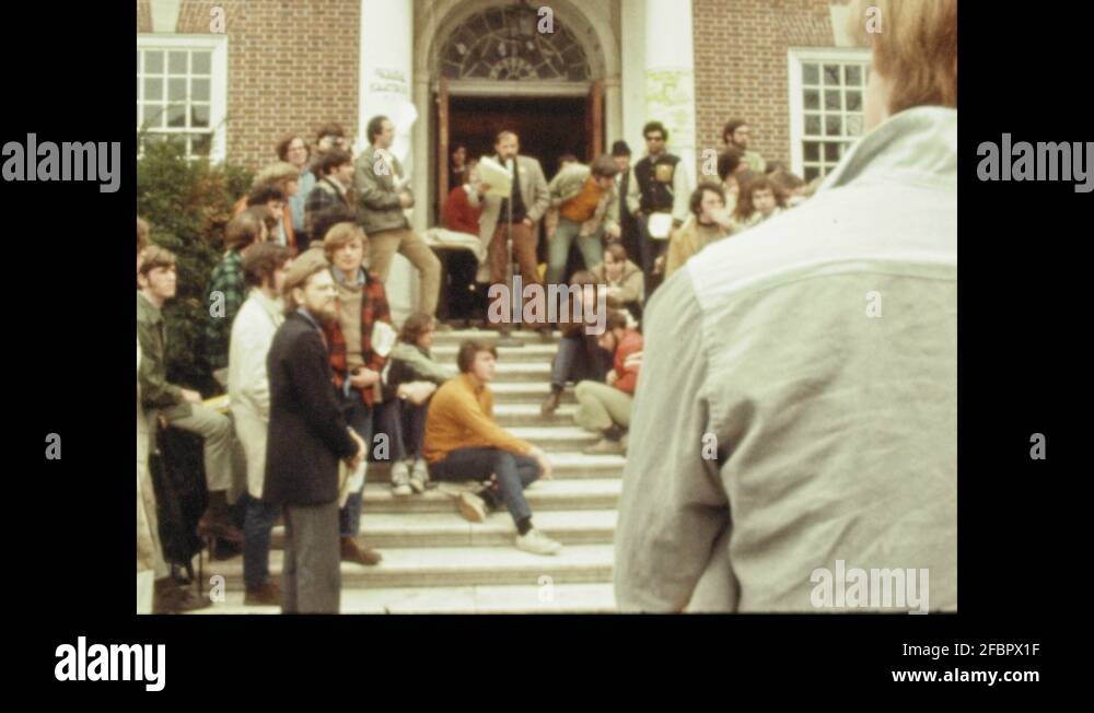 1970s: UNITED STATES: students speak at protest. Man speaks on steps of ...