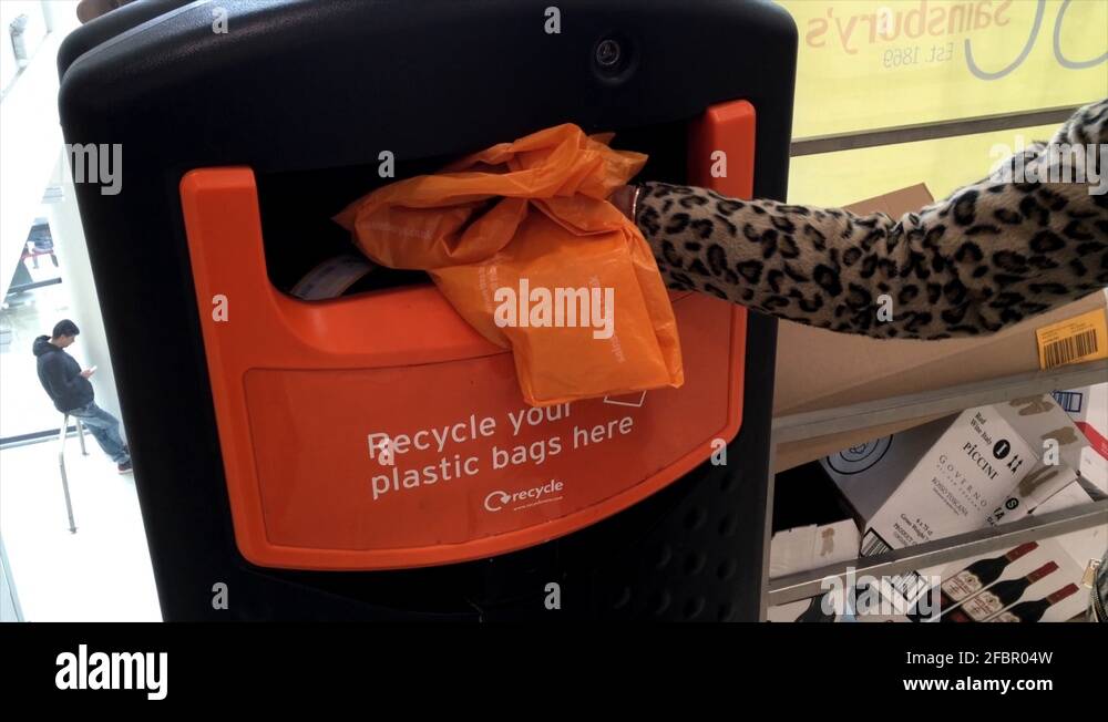 Bin to recycle plastic bags by supermarket checkouts Stock Video ...